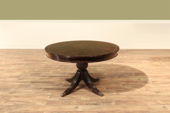 Round to oval dining table in dark walnut finish, with self-storing ...