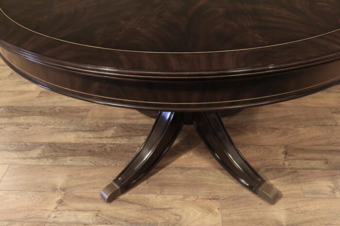 Round to oval dining table in dark walnut finish, with self-storing ...