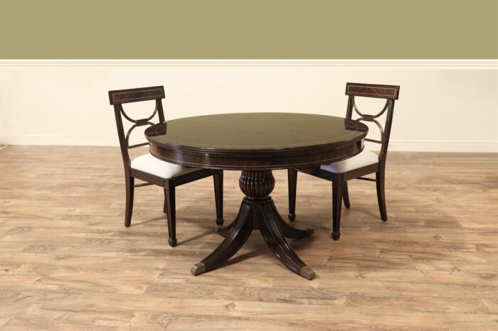 Round to oval dining table in dark walnut finish, with self-storing ...
