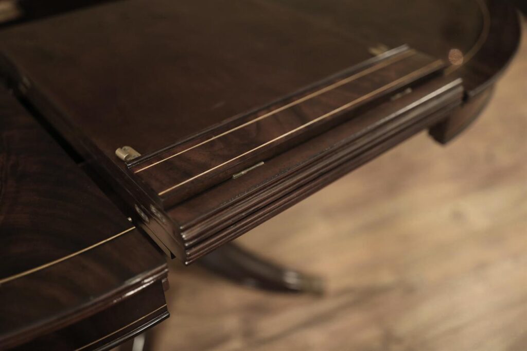 Round to oval dining table in dark walnut finish, with self-storing ...