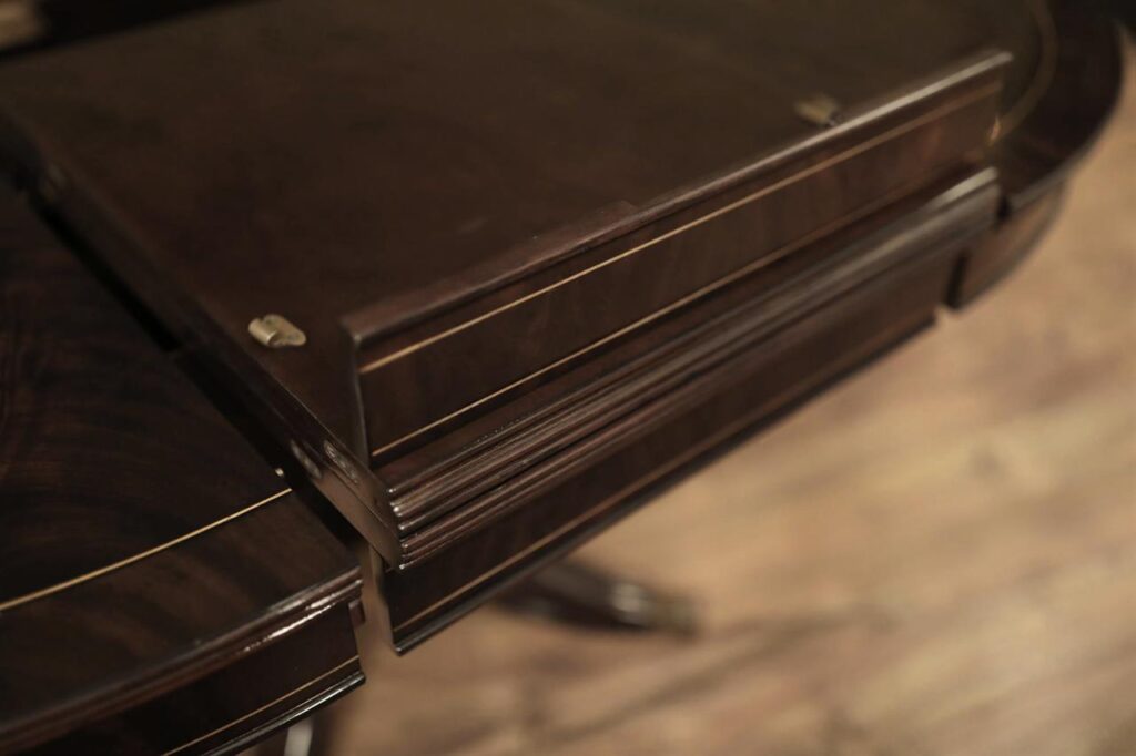 Round to oval dining table in dark walnut finish, with self-storing ...