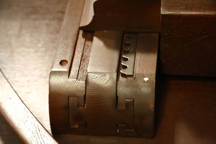 Round to oval dining table in dark walnut finish, with self-storing ...