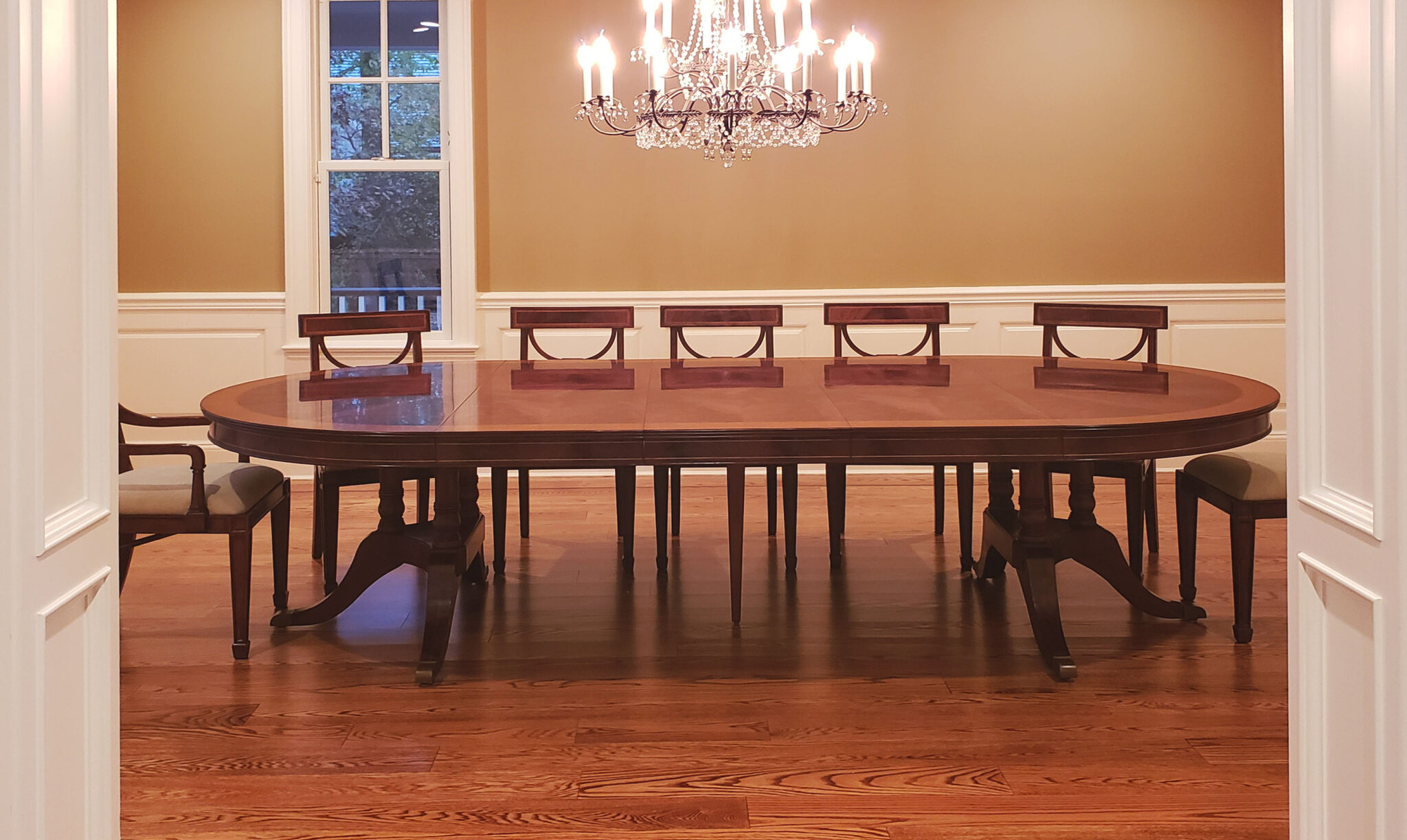 60 inch Round Mahogany Dining Table Opens to 10 feet and seats 12
