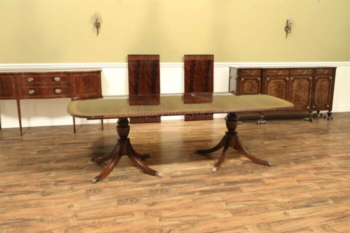 12 foot inlaid mahogany dining table with leaves. Brown mahogany finish ...