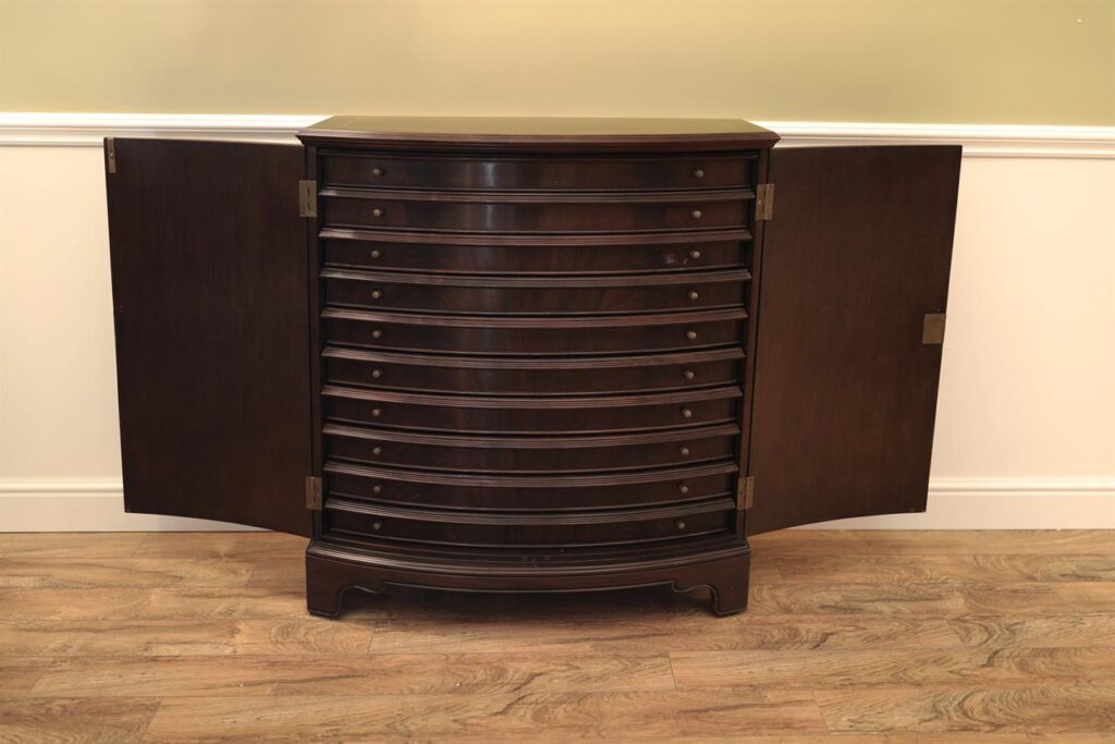 Large round expandable mahogany dining table with matching leaf storage ...