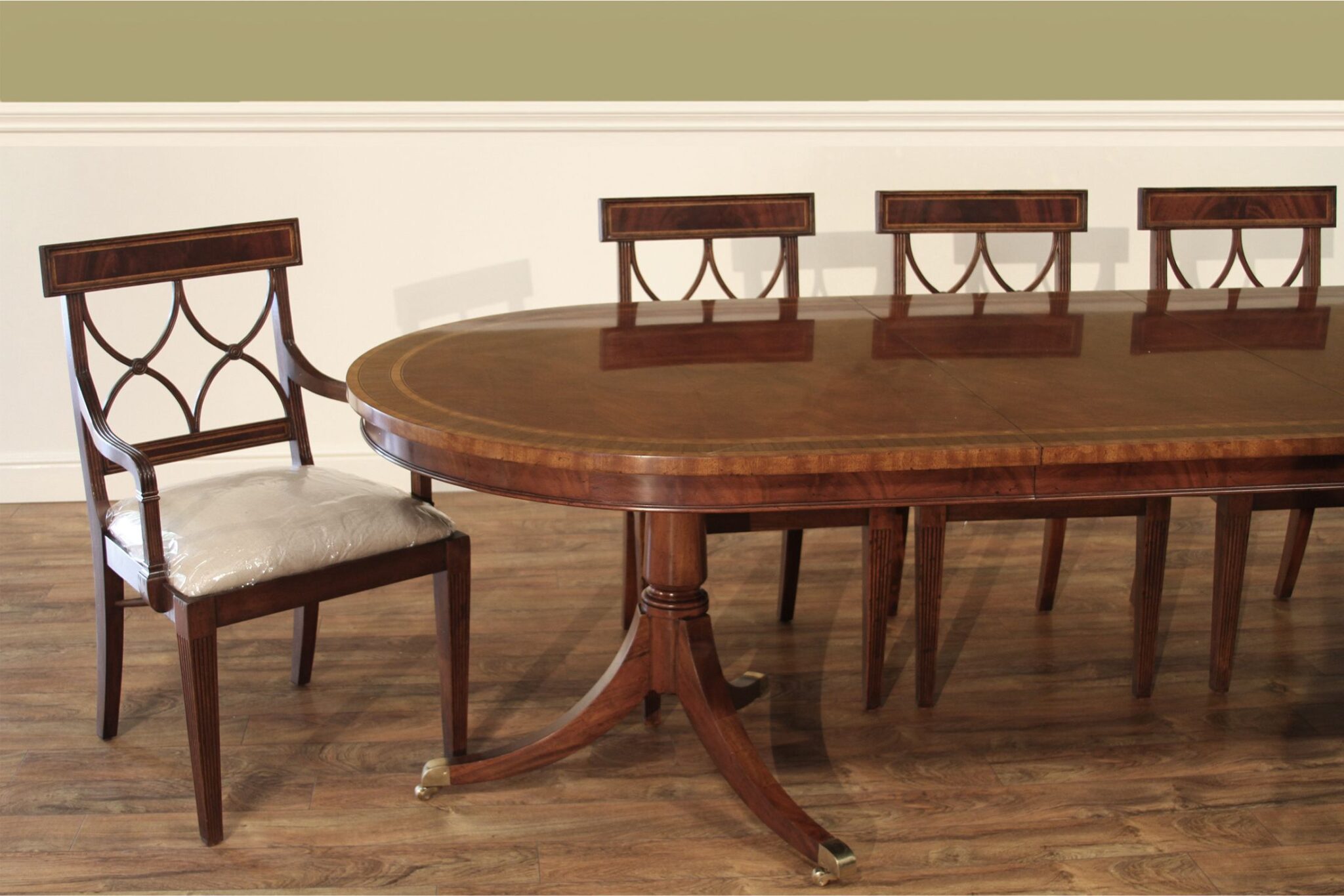 Oval double pedestal inlaid mahogany dining table