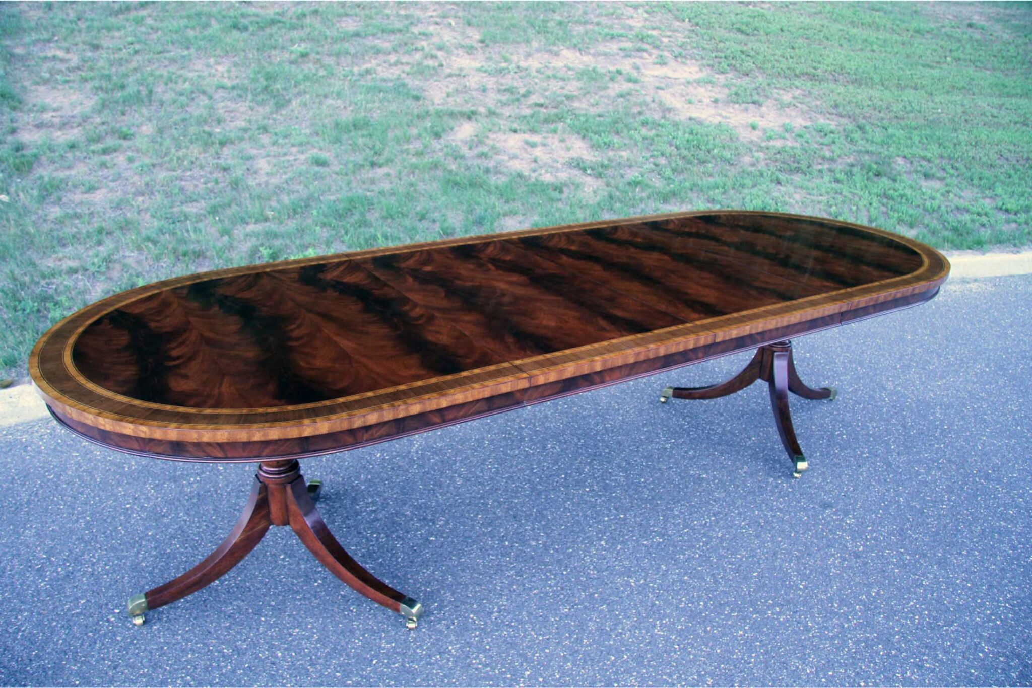 Oval double pedestal inlaid mahogany dining table